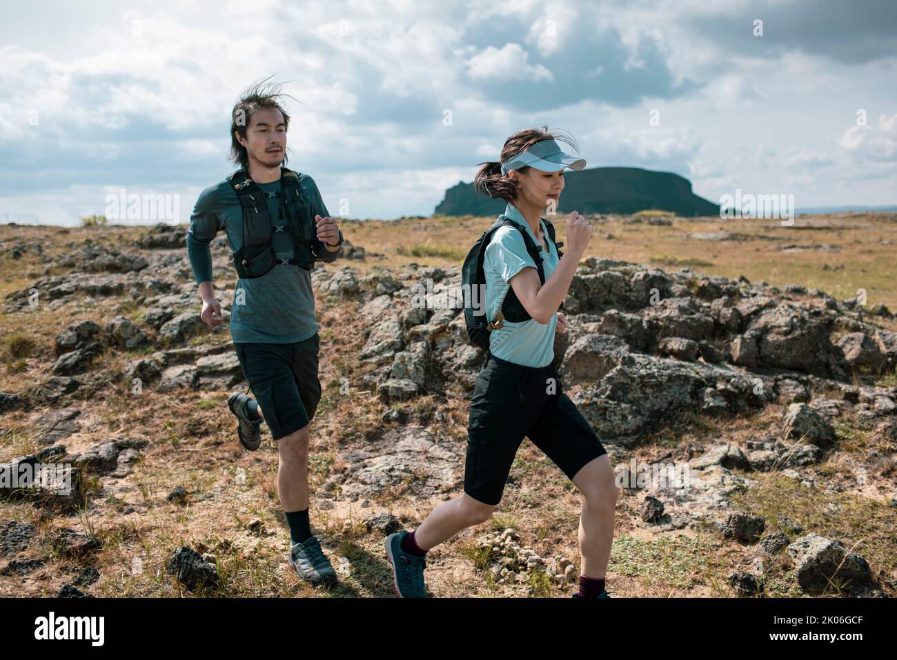 Happy Chinese couple trail running in nature Stock Photo - Alamy
