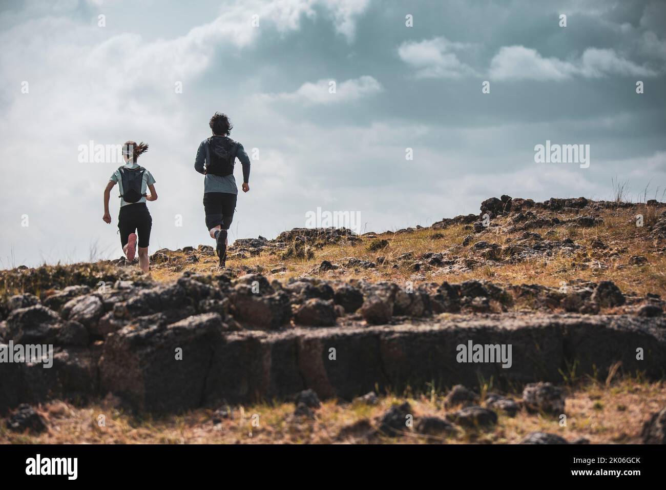Happy Chinese couple trail running in nature Stock Photo - Alamy