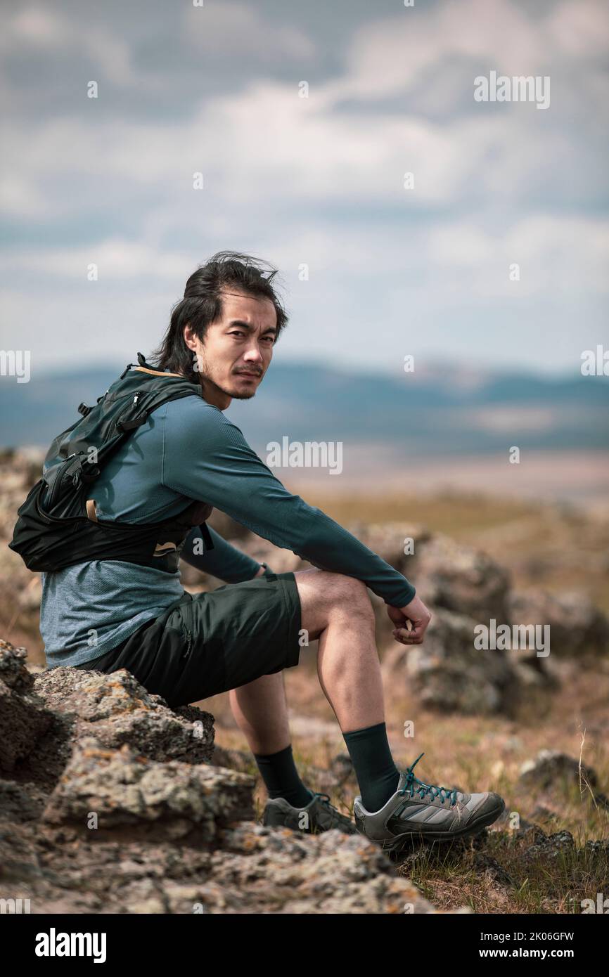 Male athlete sitting on mountain hi-res stock photography and images ...
