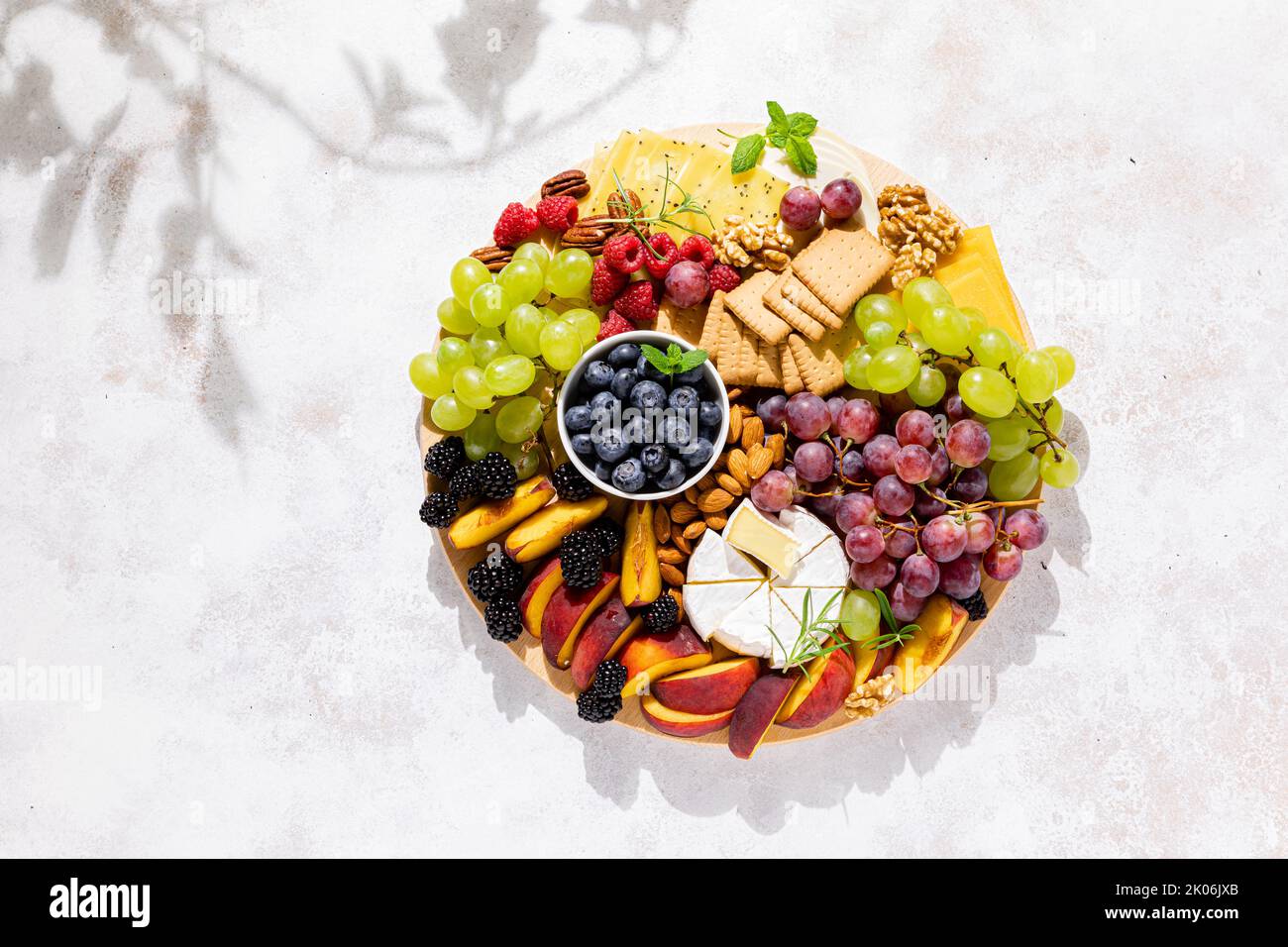 Autumn cheese board with fresh fruits and berries served with white ...