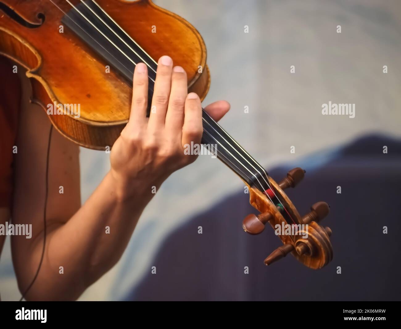 Woman with a concert violin Stock Photo - Alamy