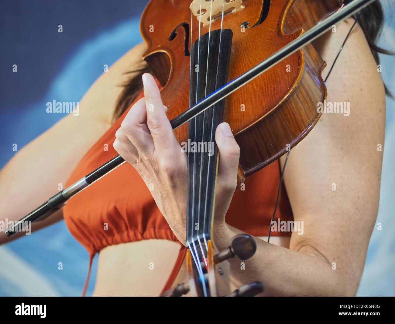 Woman with a concert violin Stock Photo - Alamy