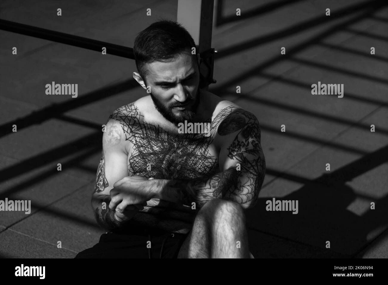 Strong young man exercises Black and White Stock Photos & Images - Alamy