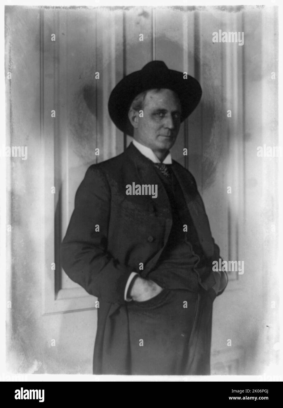 Champ Clark, half-length portrait, standing, facing right, hands in ...