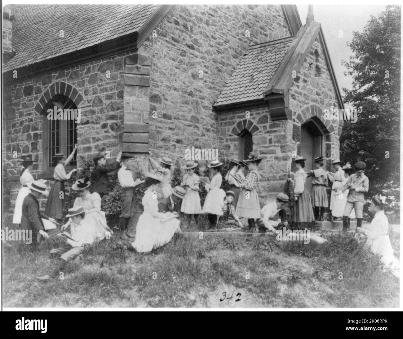 School children measuring and sketching at a stone building, Washington ...