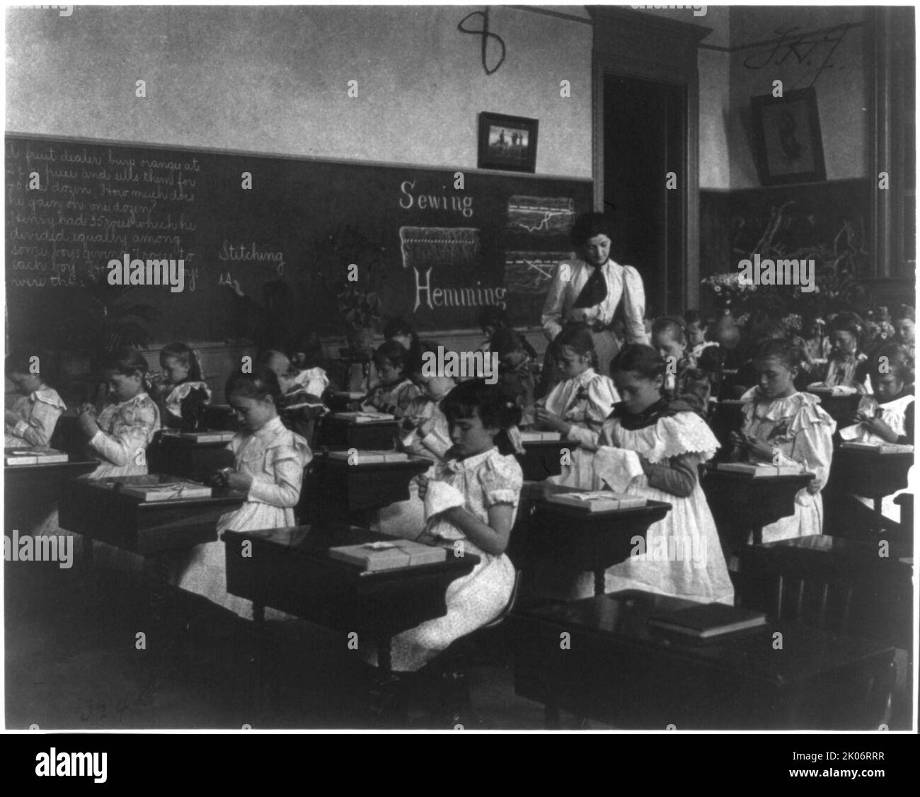 Schoolgirl in classroom Black and White Stock Photos & Images - Alamy