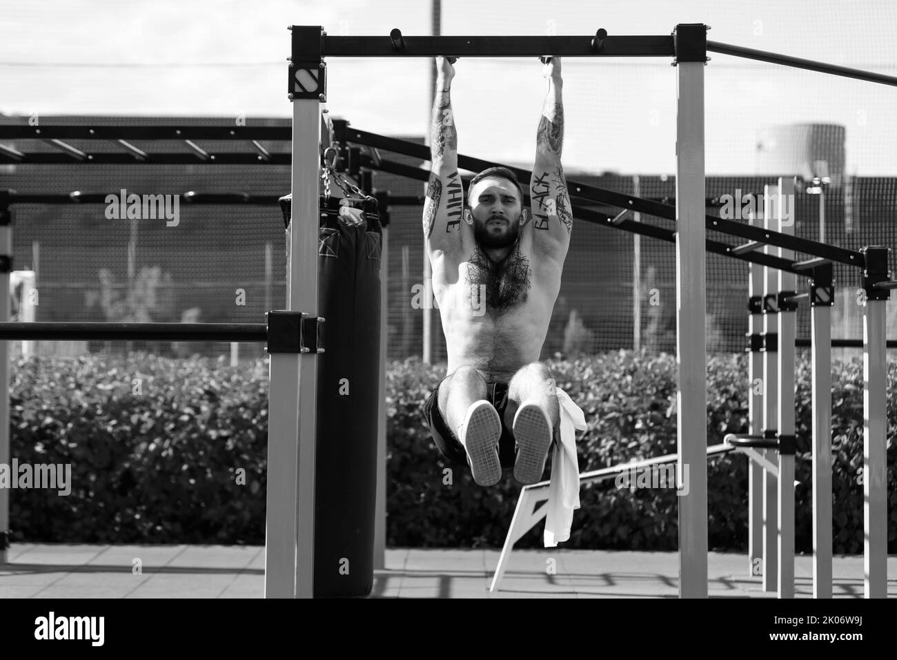 Strong young man exercises Black and White Stock Photos & Images - Alamy