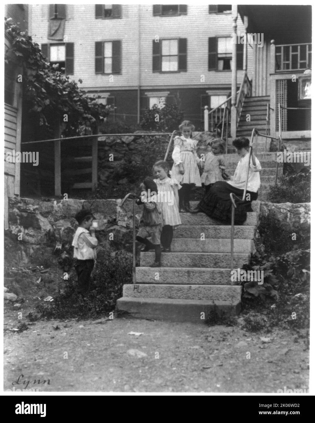 Woman on steps with 5 children, Lynn, Mass., (1895 Stock Photo - Alamy