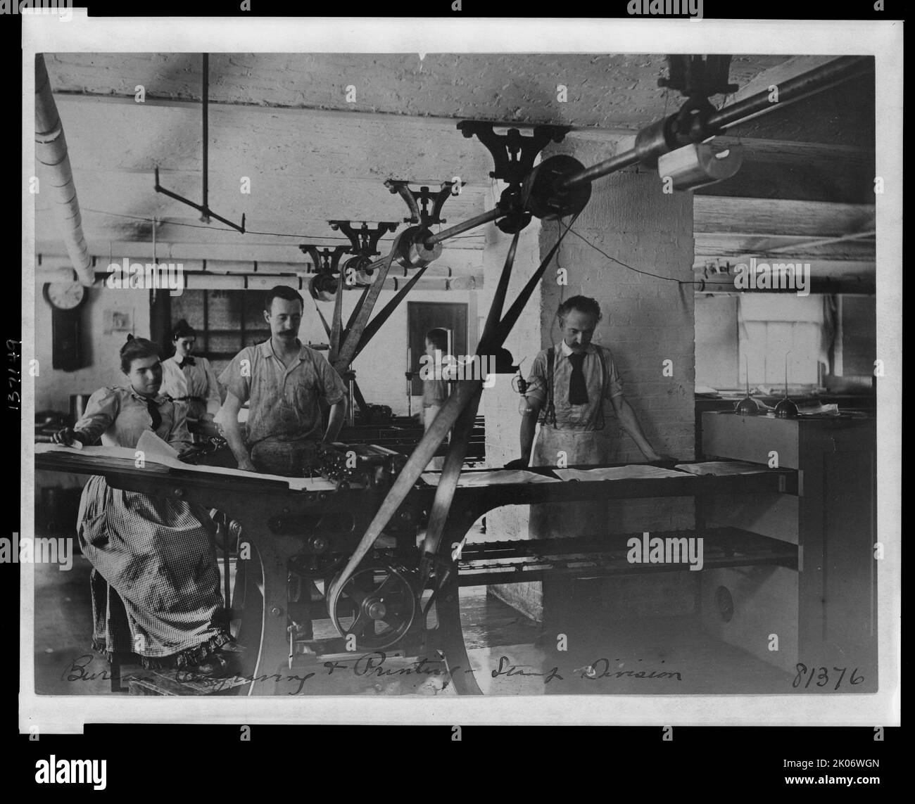 Workers in the postage stamp gumming and drying room in the Stamp ...