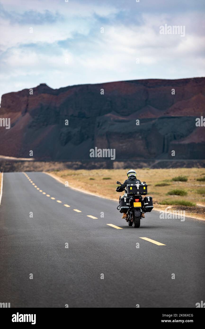 Chinese mid adult man riding motorcycle Stock Photo - Alamy