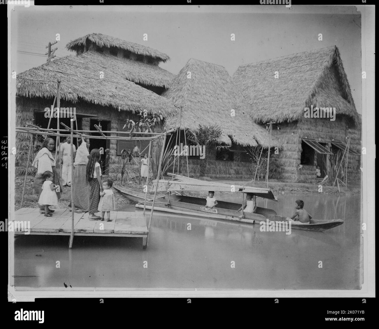 Philipine i.e., Philippine village, 1901. Photograph shows a group of ...