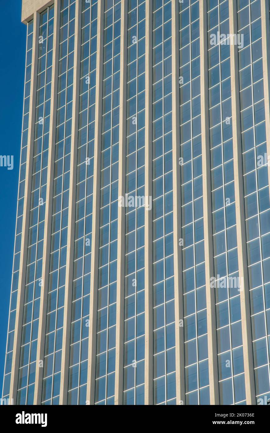 Exterior of tall commercial building with glass windows in Tucson ...