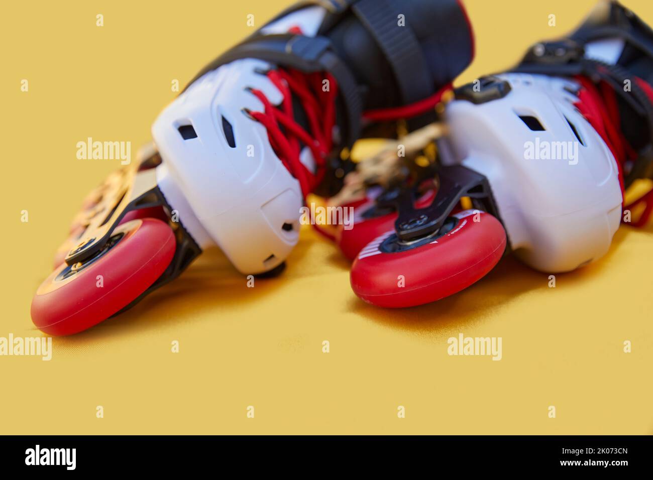 Close-up of the toe of a pair of inline skates one on top of the other ...