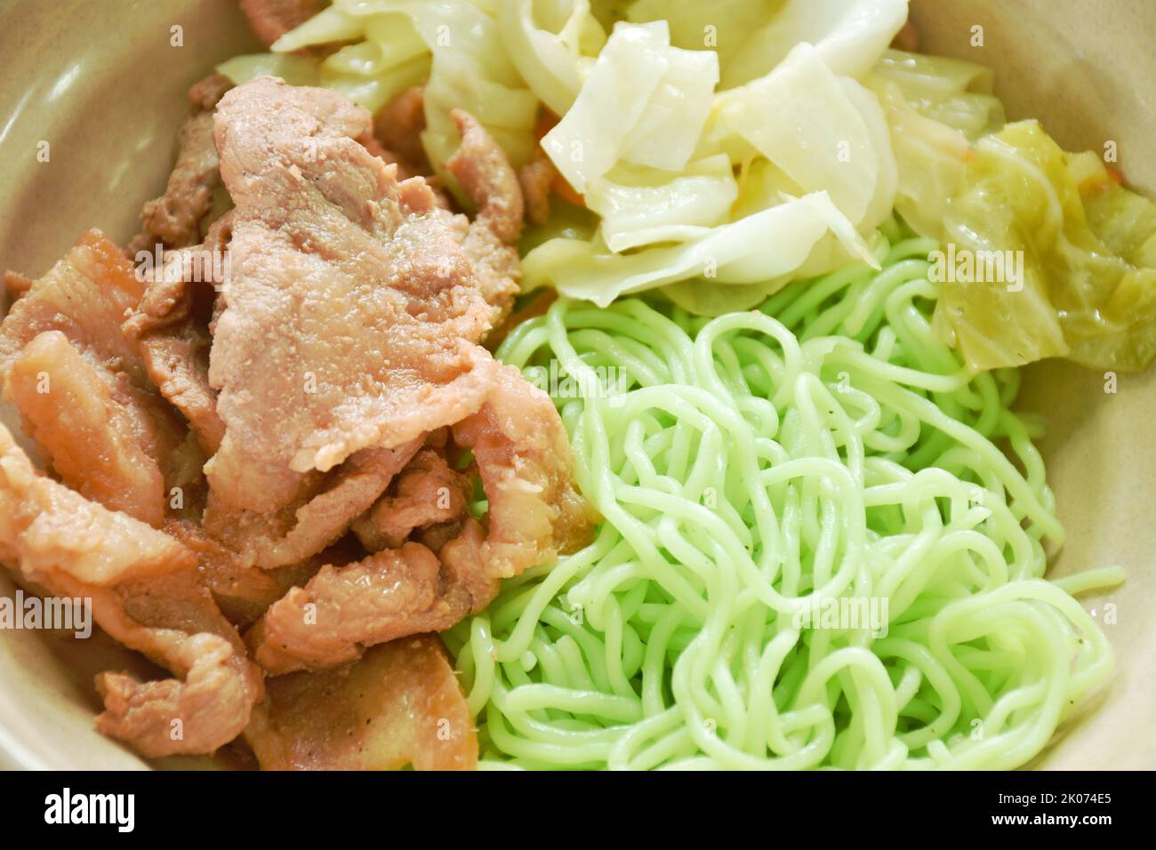 Korean fried slice pork with cabbage topping Chinese jade noodles ...