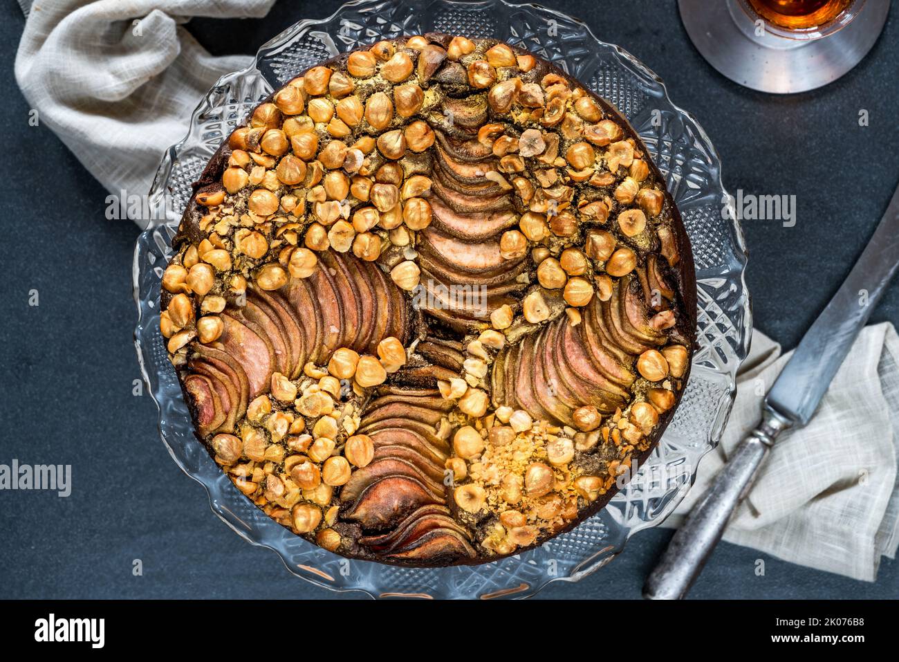 Moist chocolate, pear and golden hazelnut torte - overhead view Stock ...