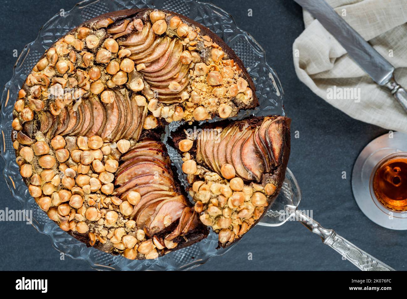 Moist chocolate, pear and golden hazelnut torte - overhead view Stock ...