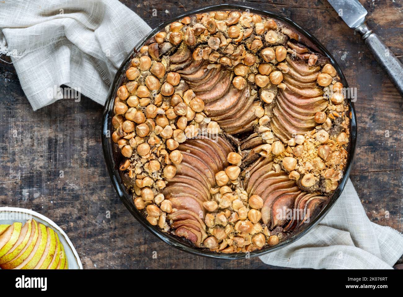 Moist chocolate, pear and golden hazelnut torte - overhead view Stock ...
