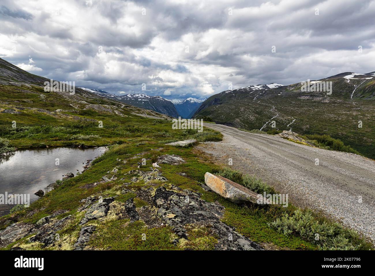 Gravel road through barren mountain landscape, impressive landscape ...