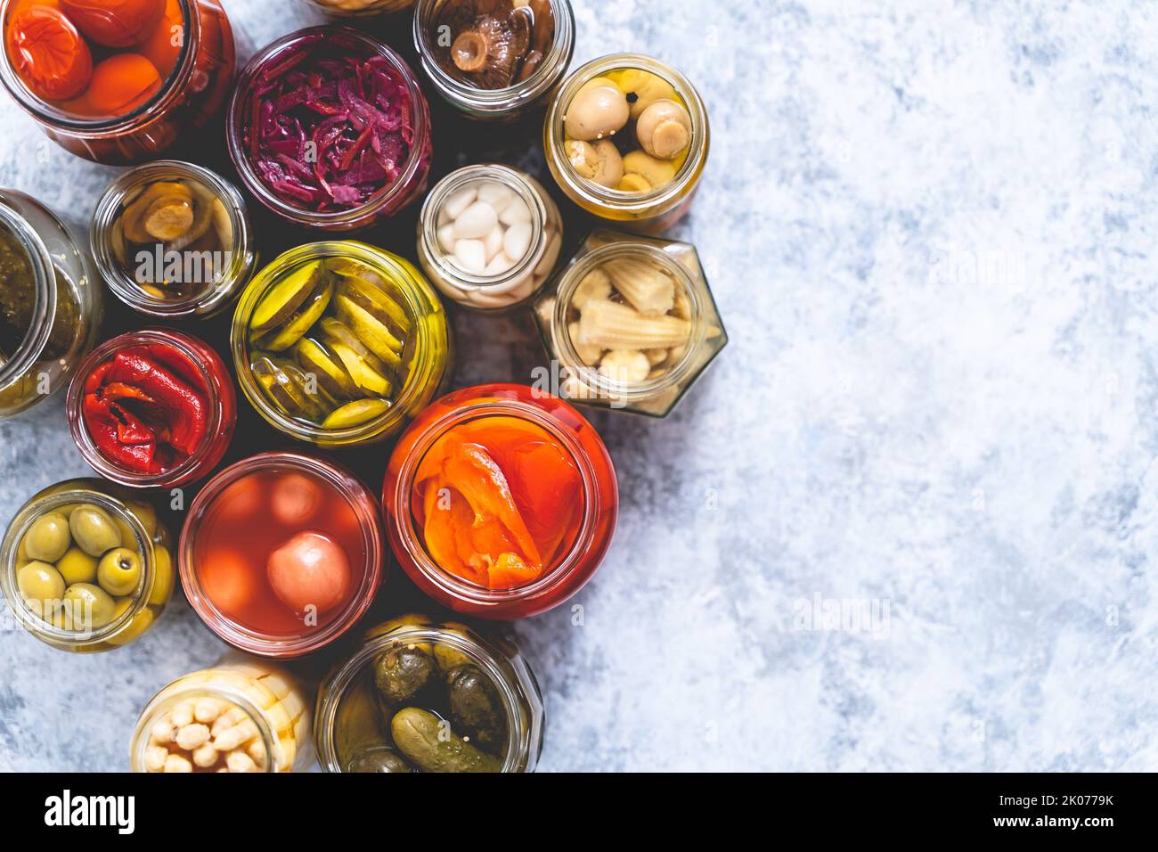 Various kinds preserves vegetables and mushrooms in glass jars Stock ...