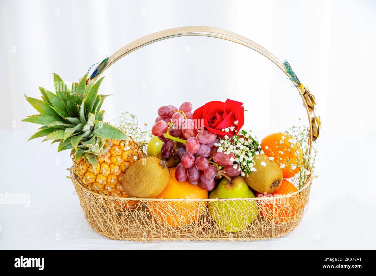 Large group of organic fresh fruits in a basket on white background ...