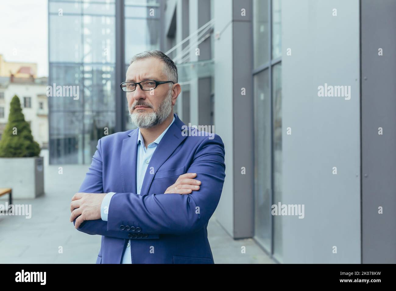 Portrait of serious senior gray haired handsome successful businessman ...