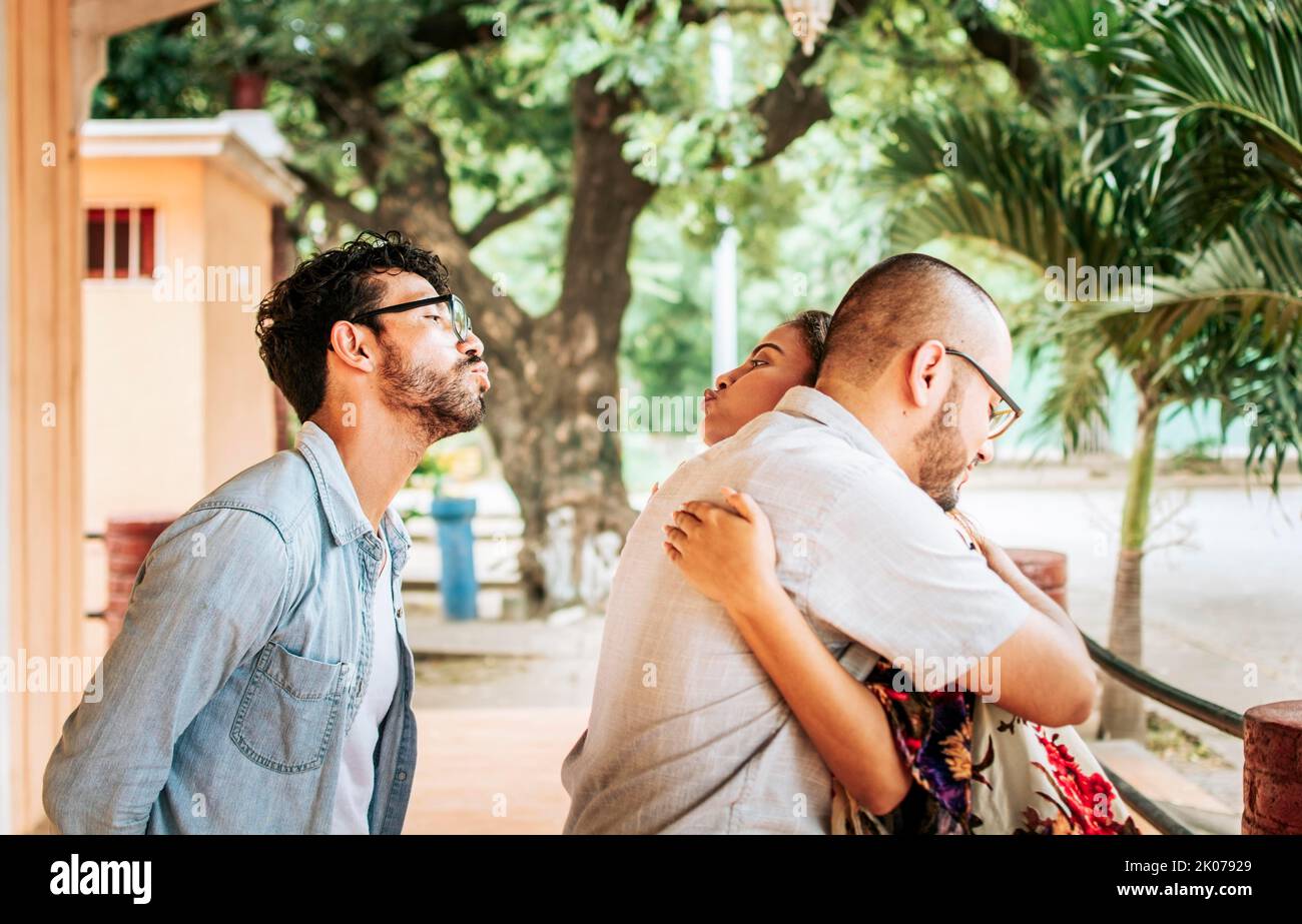 Unfaithful girlfriend hugging her boyfriend outdoors and secretly ...