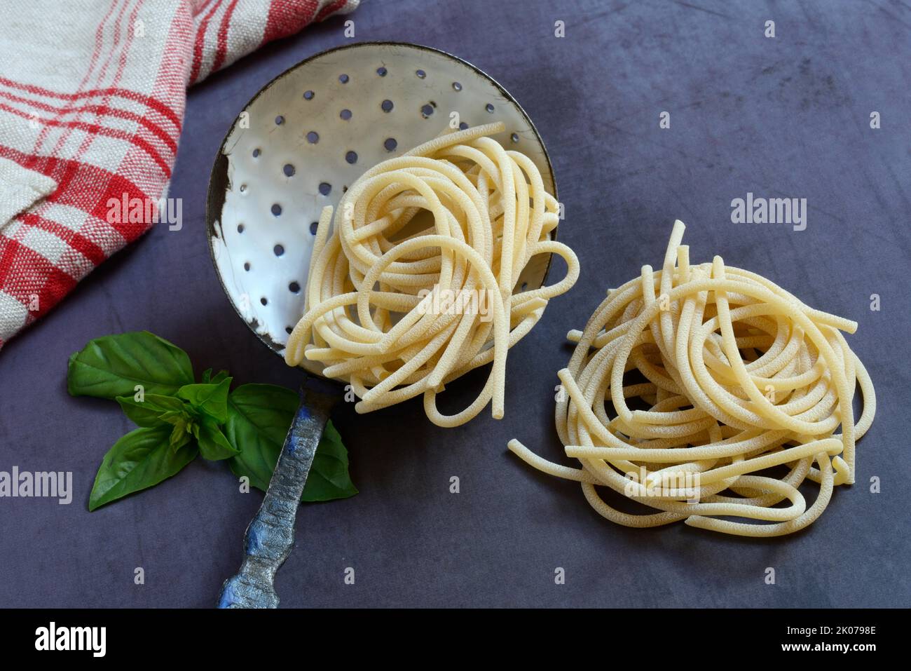Pici, Italian pasta, pasta nests on sieve ladle, pasta, noodles Stock ...