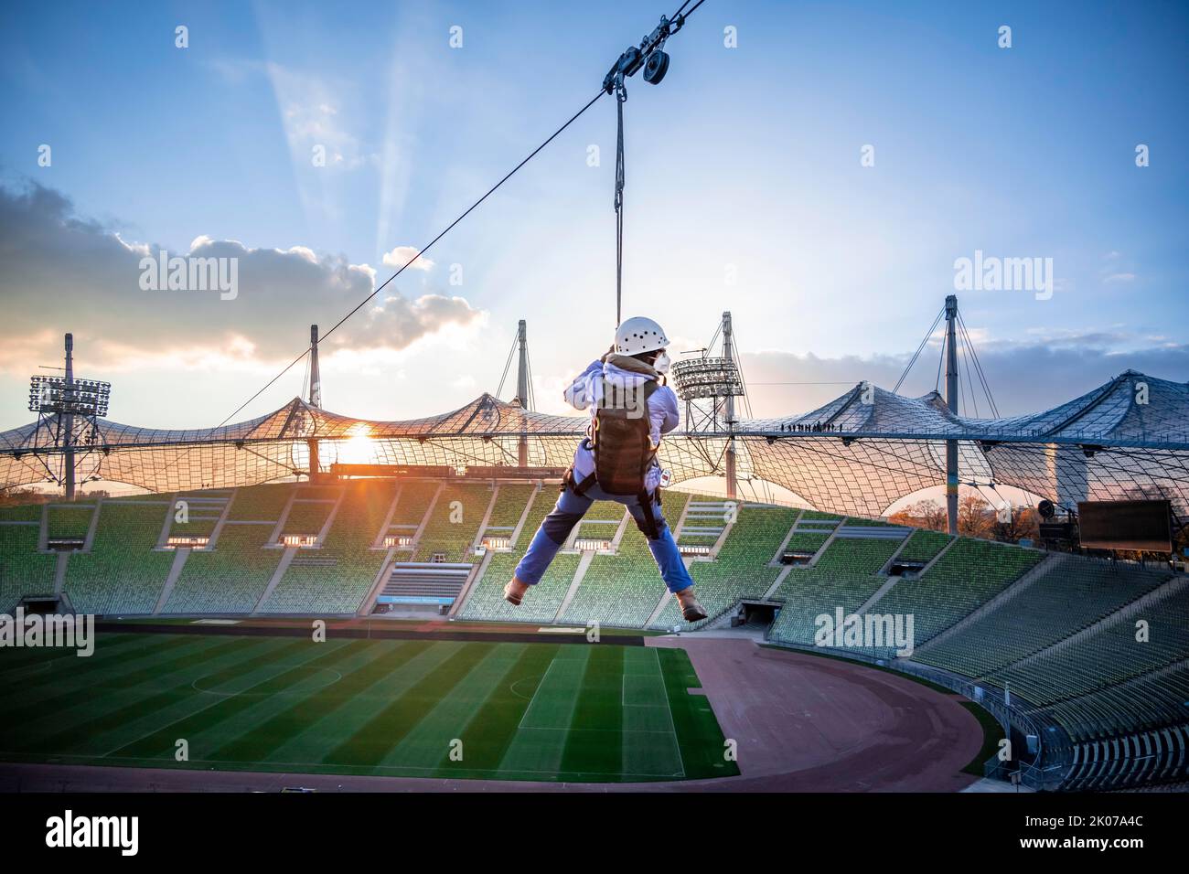Woman at a zip line above the Olympic Stadium, Olympic Stadium with ...