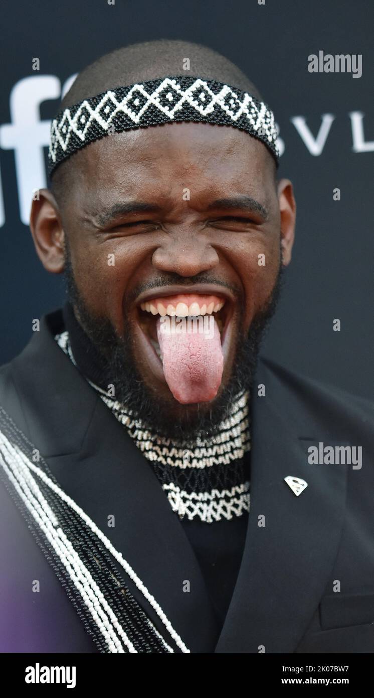 Toronto, Canada. 09th Sep, 2022. Actor Sivuyile Ngesi hams it up on the red carpet as he attends ...