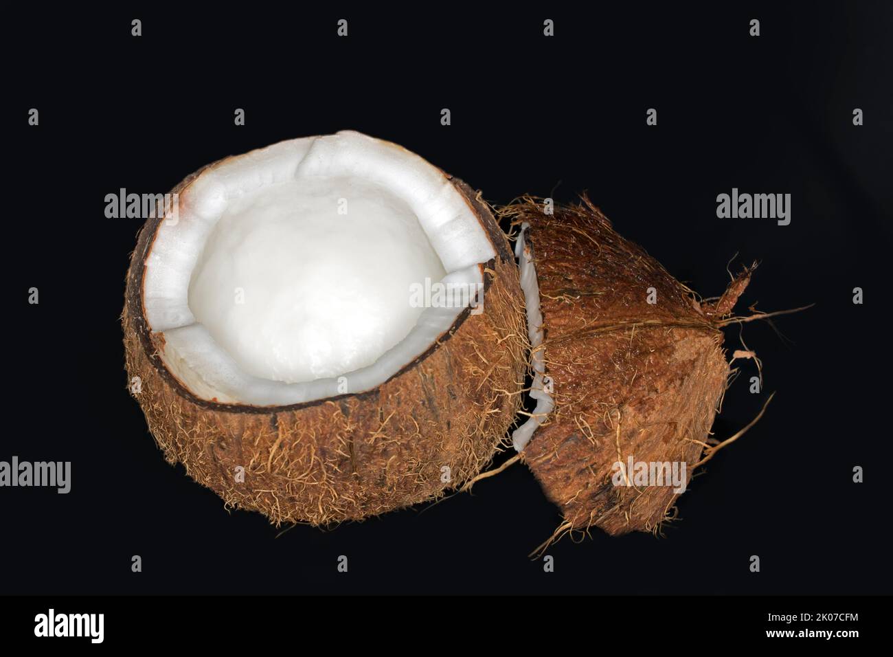 Peeled and cracked coconut palm (Cocos nucifera), food photography with ...