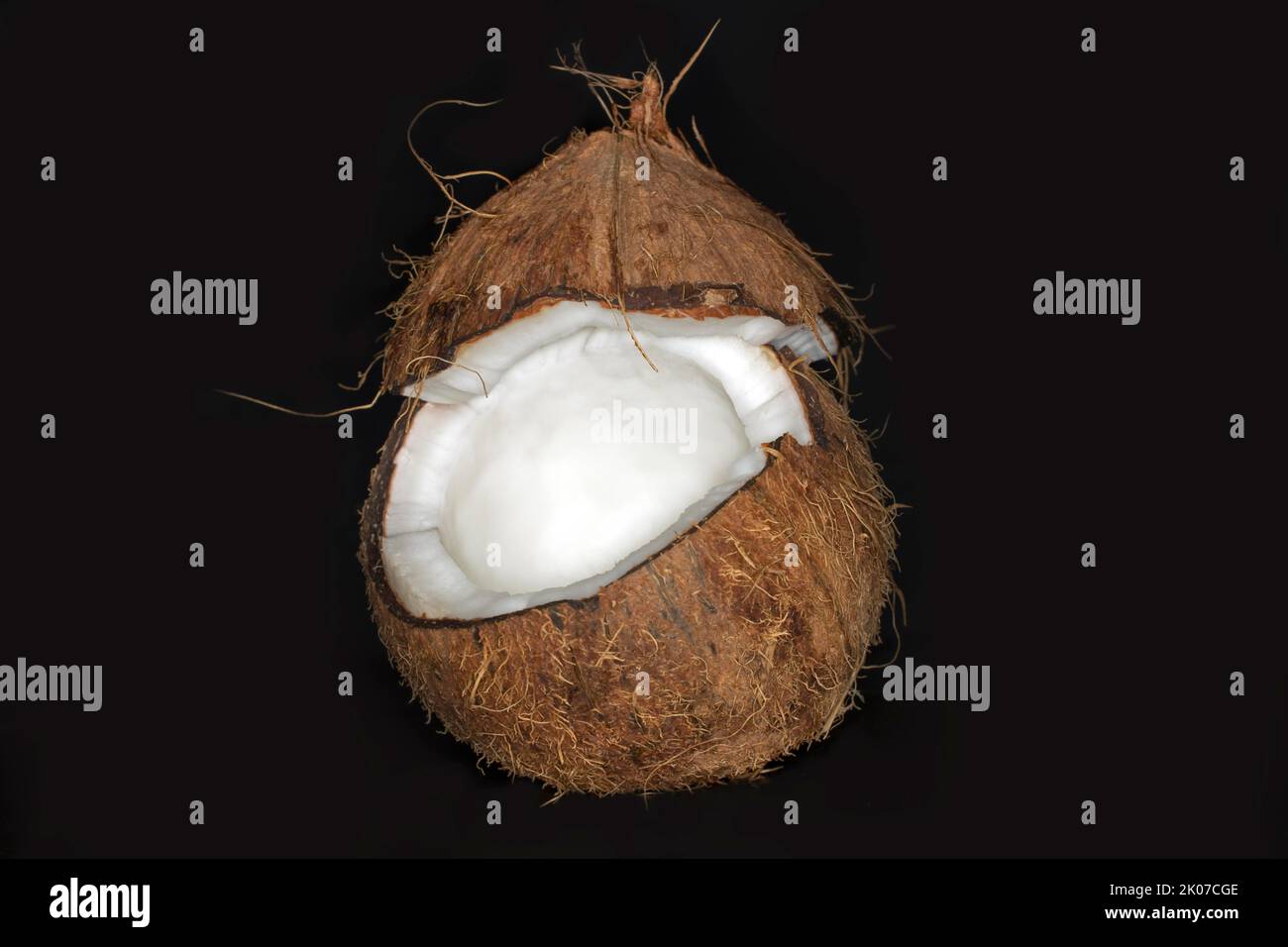 Peeled and cracked coconut palm (Cocos nucifera), food photography with ...