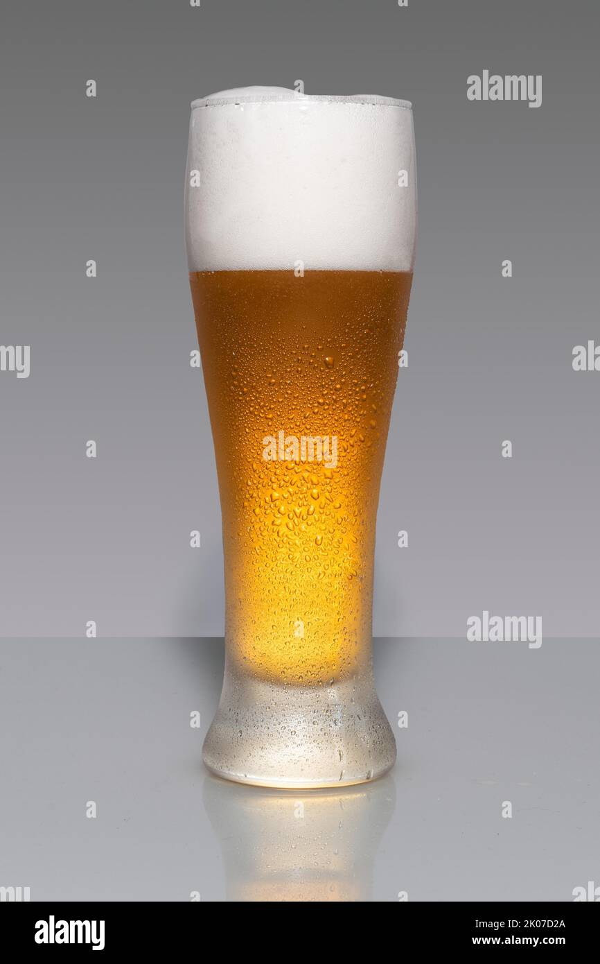 Cold beer isolated over grey background. Studio shot Stock Photo - Alamy