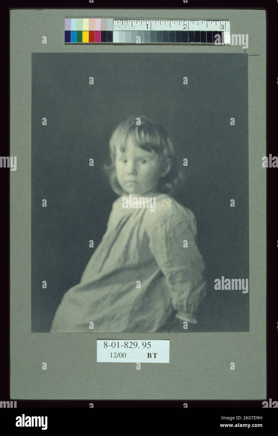 Seated girl with body facing left looking at the camera, c1900 Stock ...