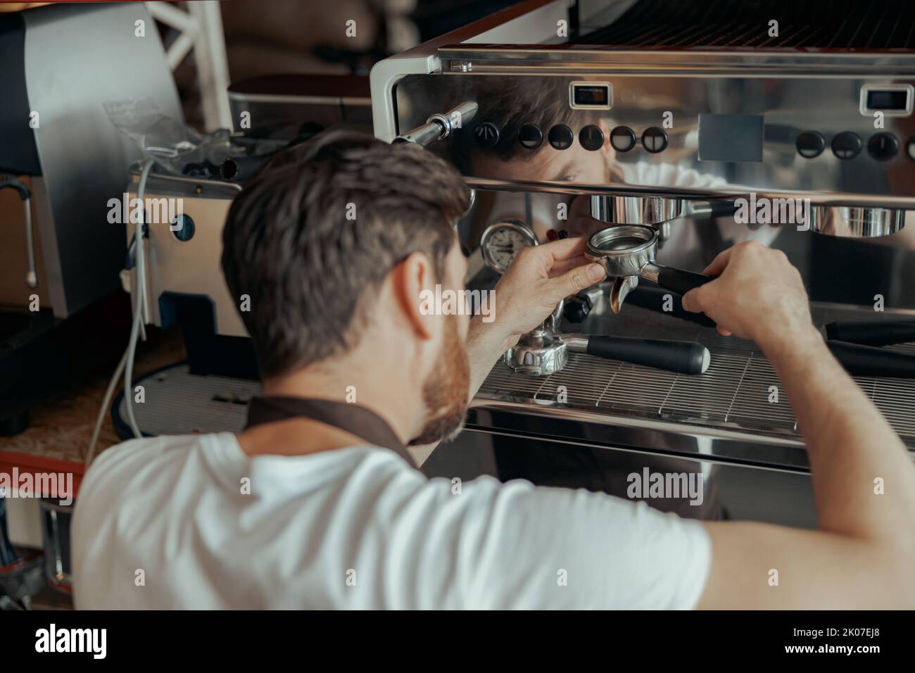 Man fixing coffee machine hi-res stock photography and images - Alamy