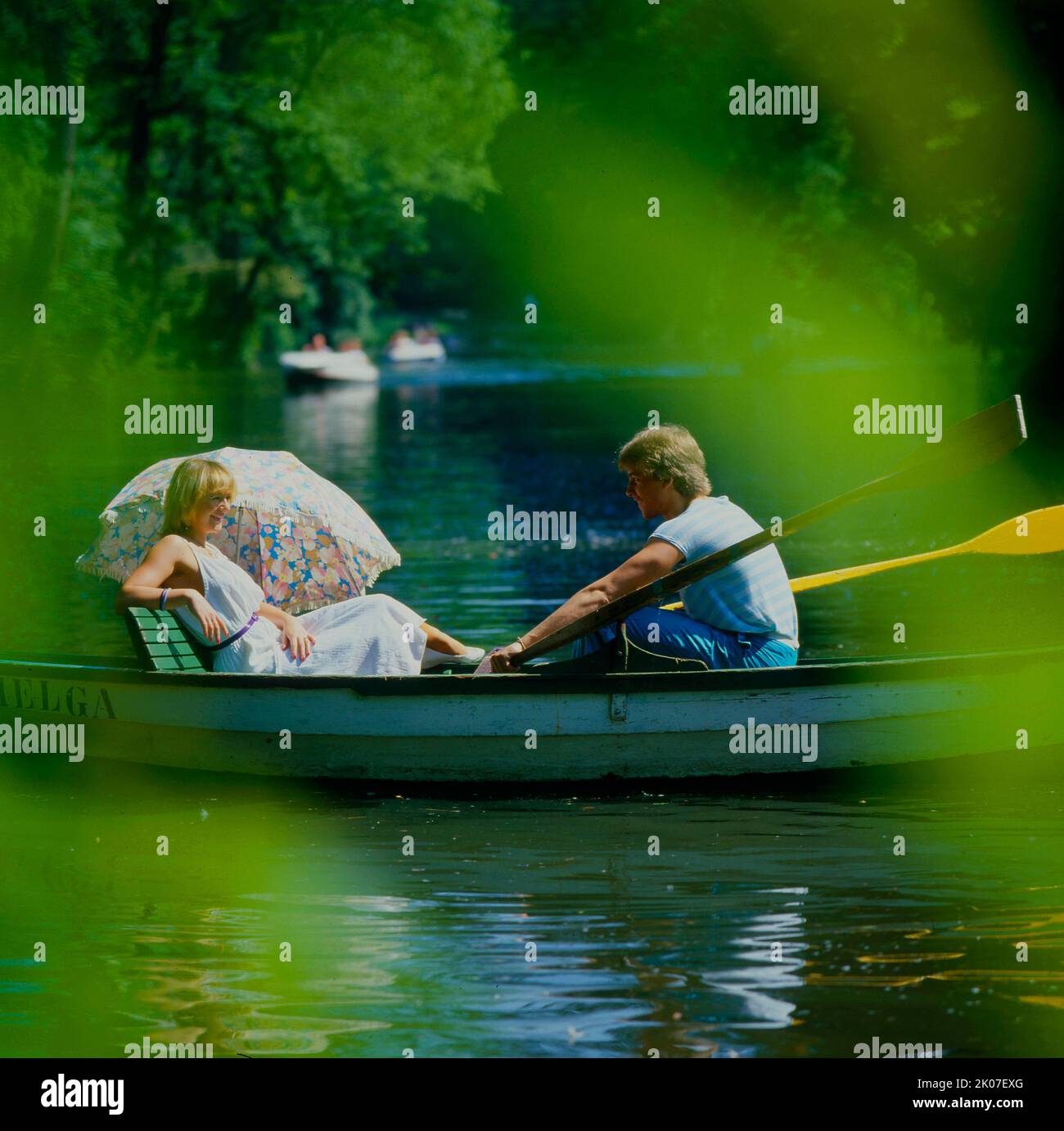 Couple in a rowing boat Stock Photo - Alamy