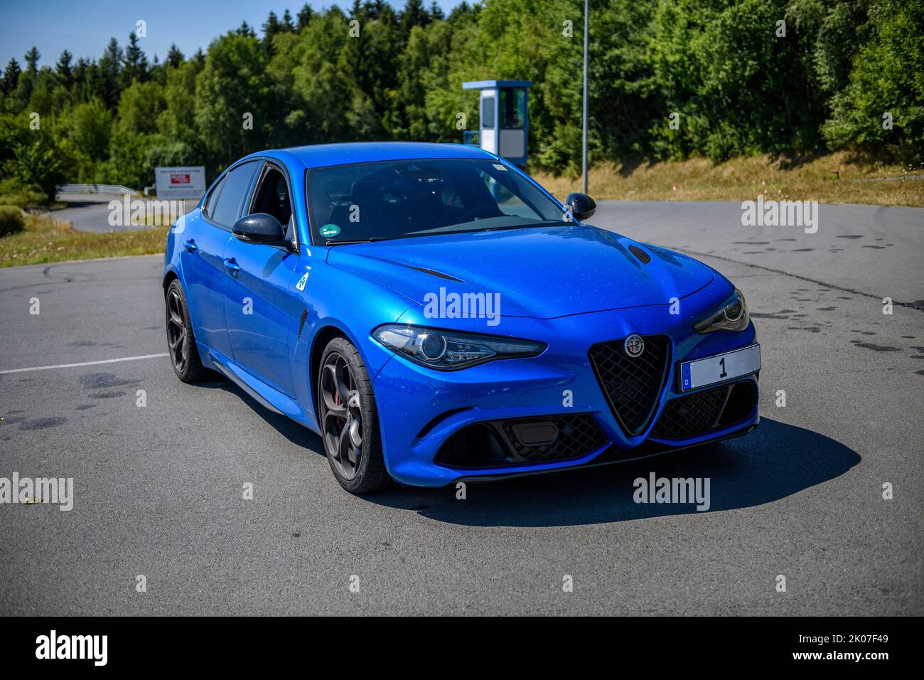 Italian sports car blue Alfa Romeo Giulia Q4 on the premises of driving ...