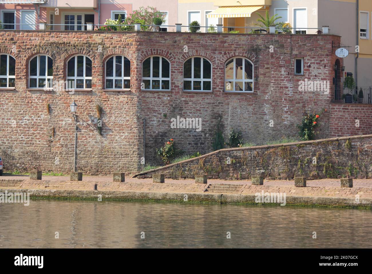 View of riverside promenade in Neckargemuend with Neckar river, Neckar ...