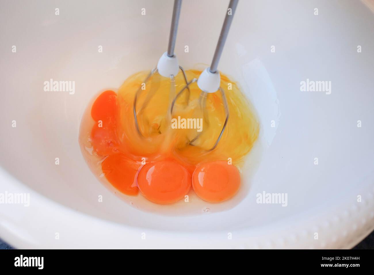 Swabian cuisine, preparation of chard cake, mixing eggs, egg yolk and egg white, whisk from hand ...