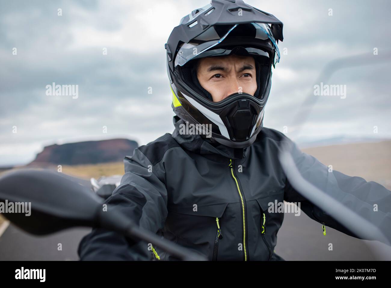 Chinese mid adult man riding motorcycle Stock Photo - Alamy