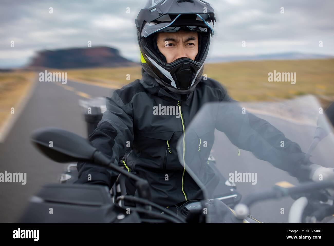 Chinese mid adult man riding motorcycle Stock Photo - Alamy