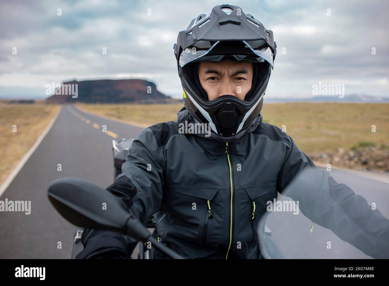 Chinese mid adult man riding motorcycle Stock Photo - Alamy