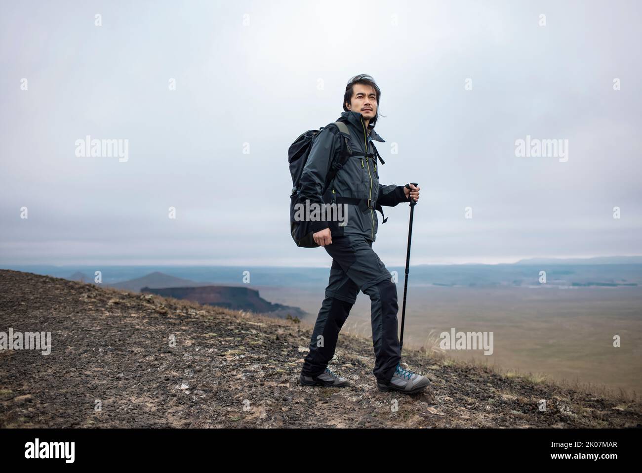 Chinese mid adult man hiking outdoors Stock Photo - Alamy