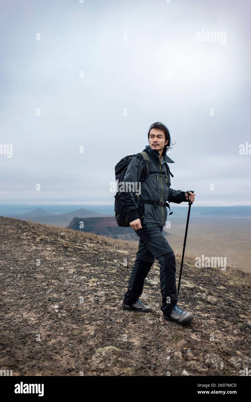 Chinese mid adult man hiking outdoors Stock Photo - Alamy
