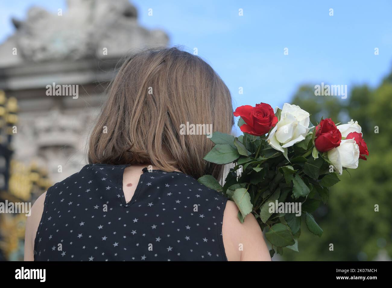 London, UK. 10th Sep, 2022. Flowers for the Queen. A woman waits to lay ...