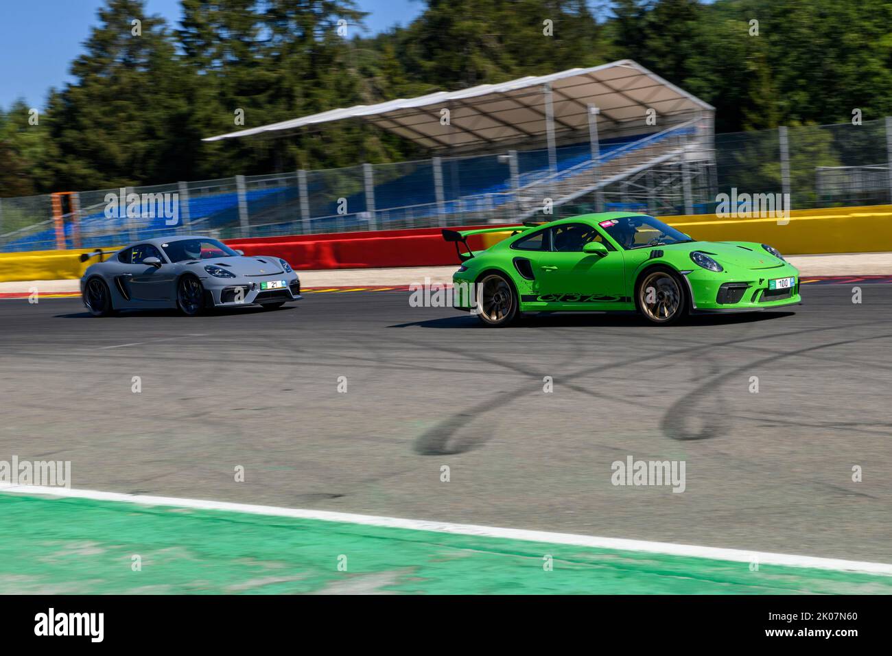 Racing car sports car right Porsche GT3 overtakes left Porsche Cayman ...