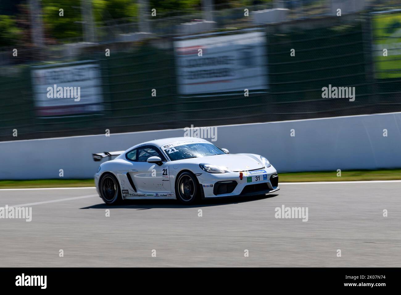 Racing car sports car Porsche Cayman GT4 races at high speed full ...