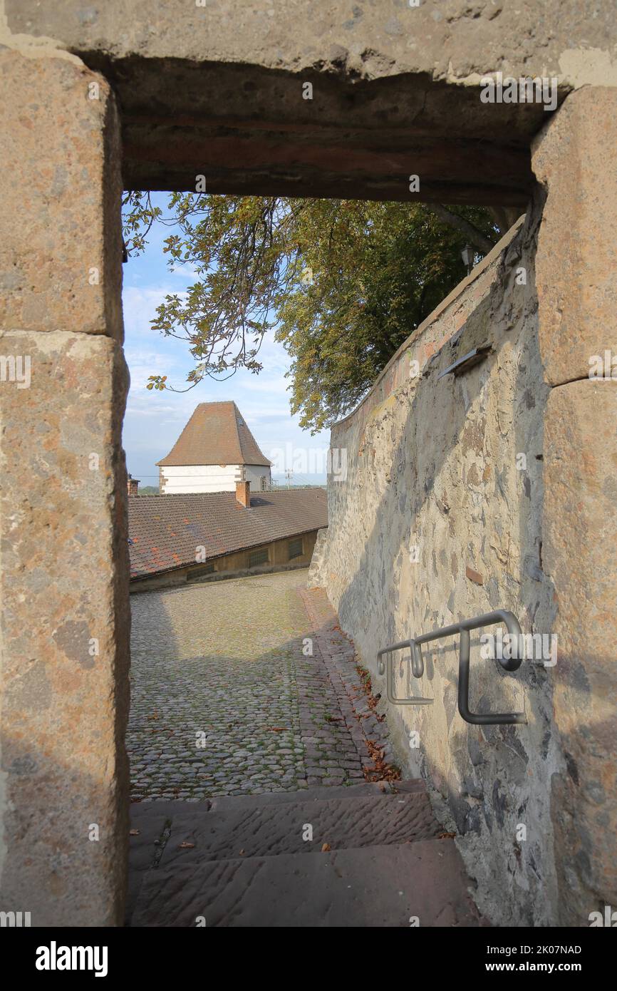 View through the gate of the city wall on the historic Hagenbach Tower ...