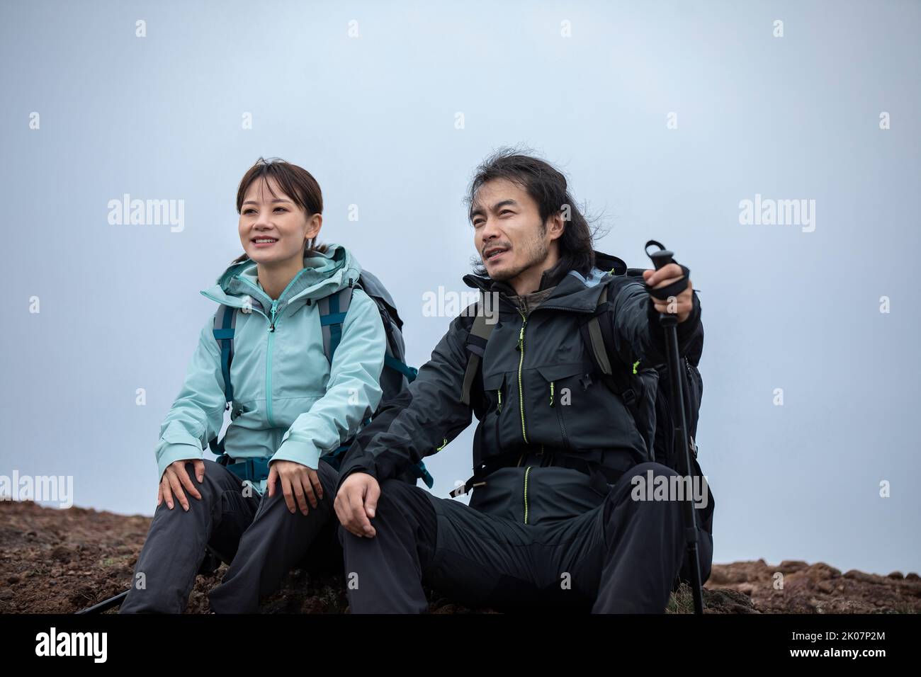 Happy Chinese couple hiking outdoors Stock Photo - Alamy