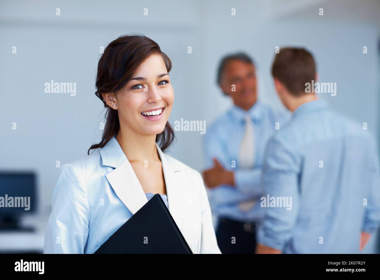 Young business woman. Portrait of beautiful business woman smiling with ...