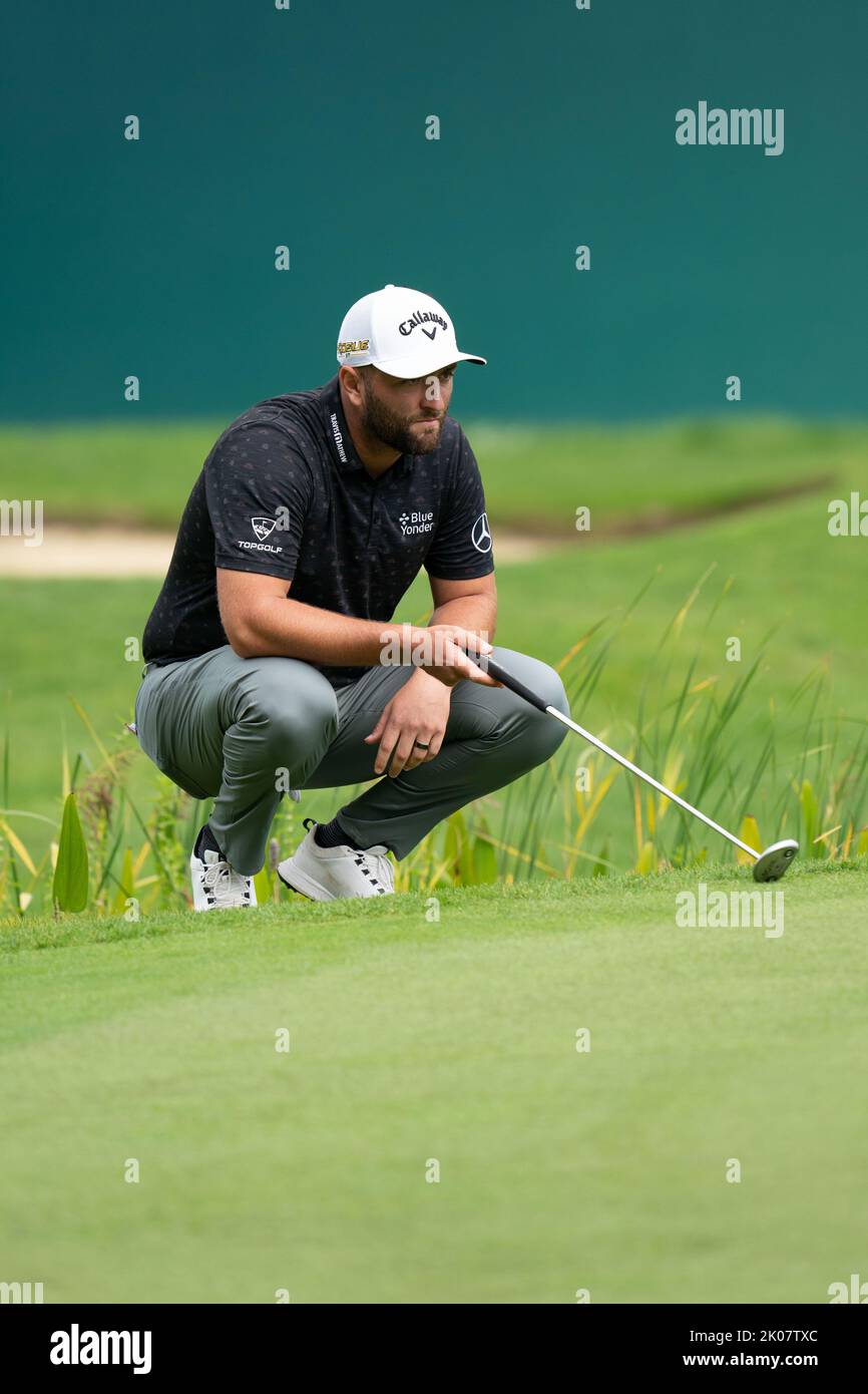 Jon Rahm (ESP) lines up a putt on the 18th green during the BMW PGA ...